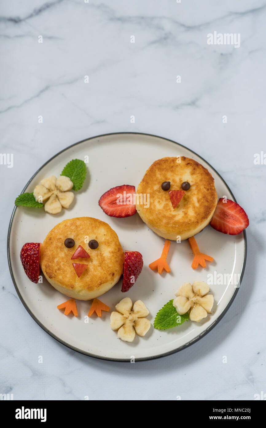 Birds ricotta pancakes for kids breakfast Stock Photo - Alamy