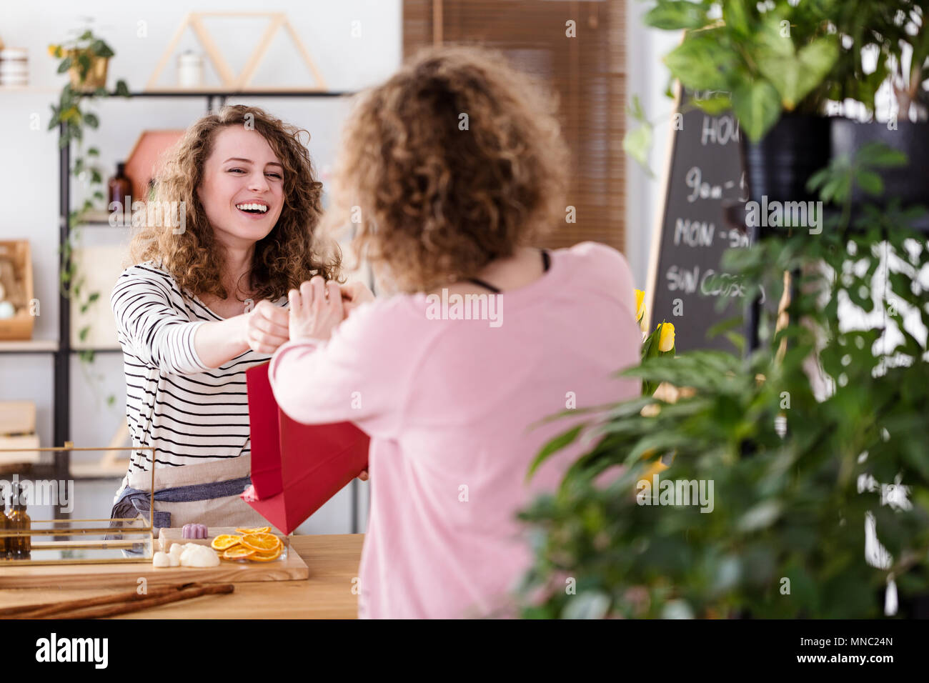 Happy saleswoman hi-res stock photography and images - Alamy