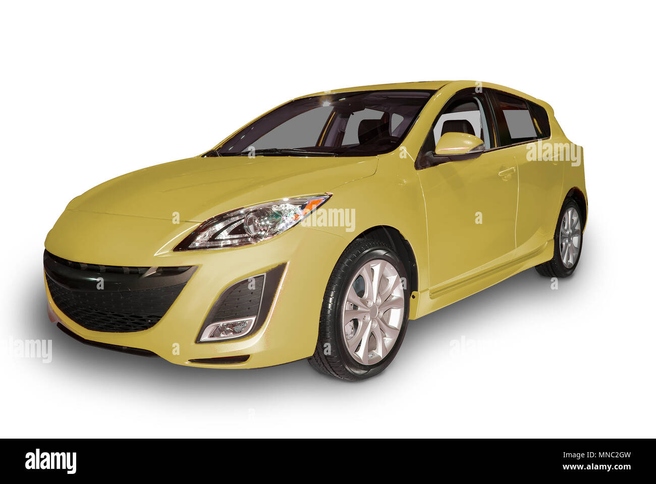 A yellow four door compact hybrid car isolated on a white background. A ...