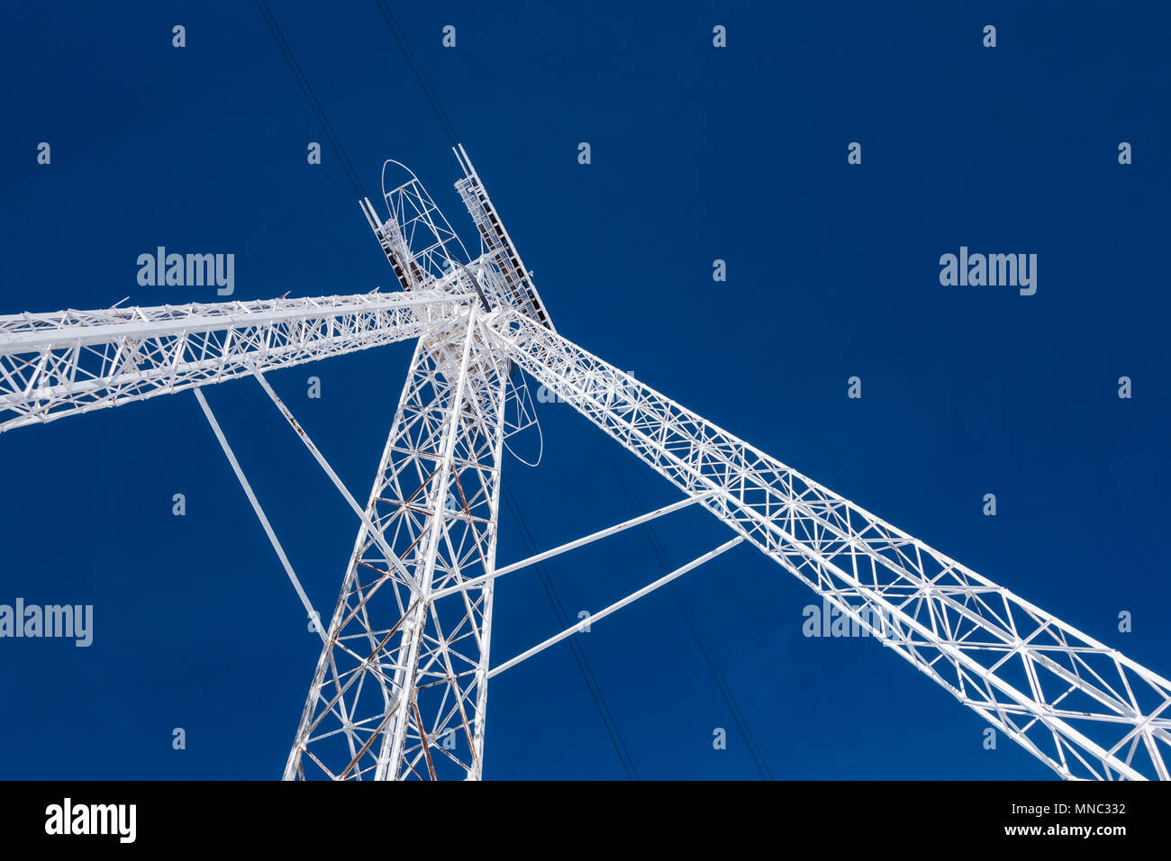 Cable car ski lift pylon in white steel in perspective from below ...
