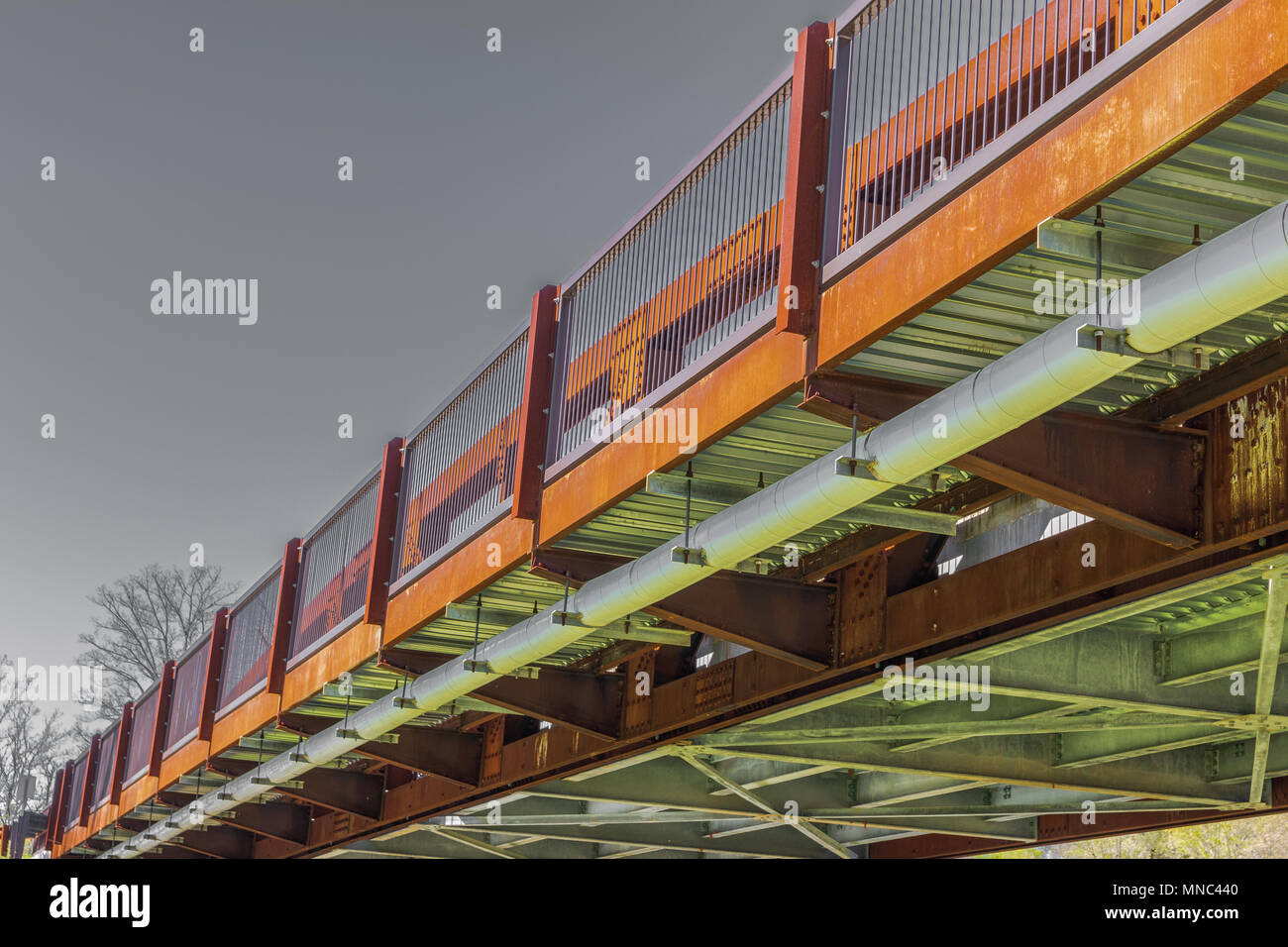 Diagonal view of colorful steel bridge from below Stock Photo - Alamy