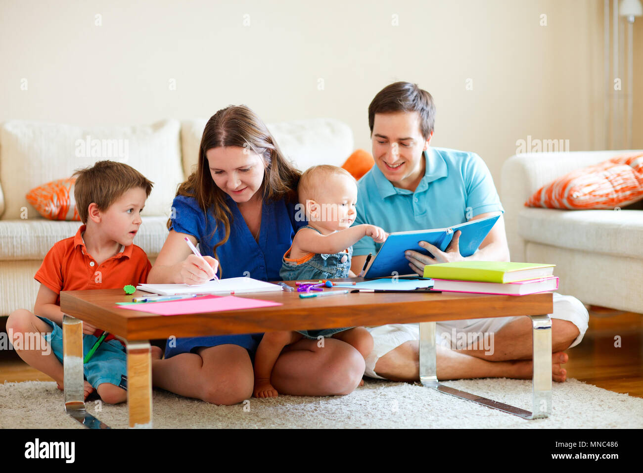 Boy reading girl drawing hi-res stock photography and images - Alamy
