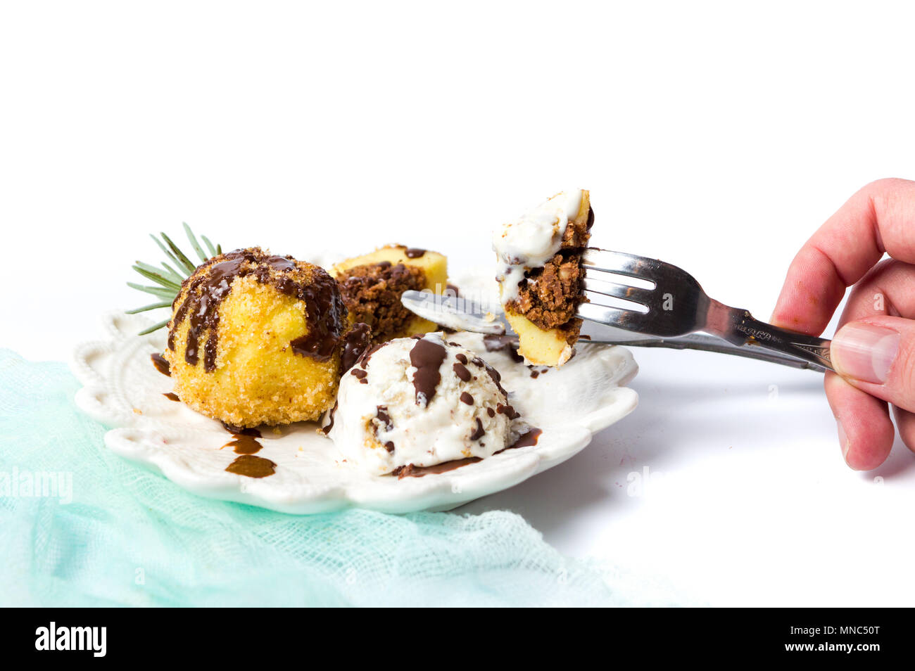 Person eating breadcrumb dumpling against white background Stock Photo ...