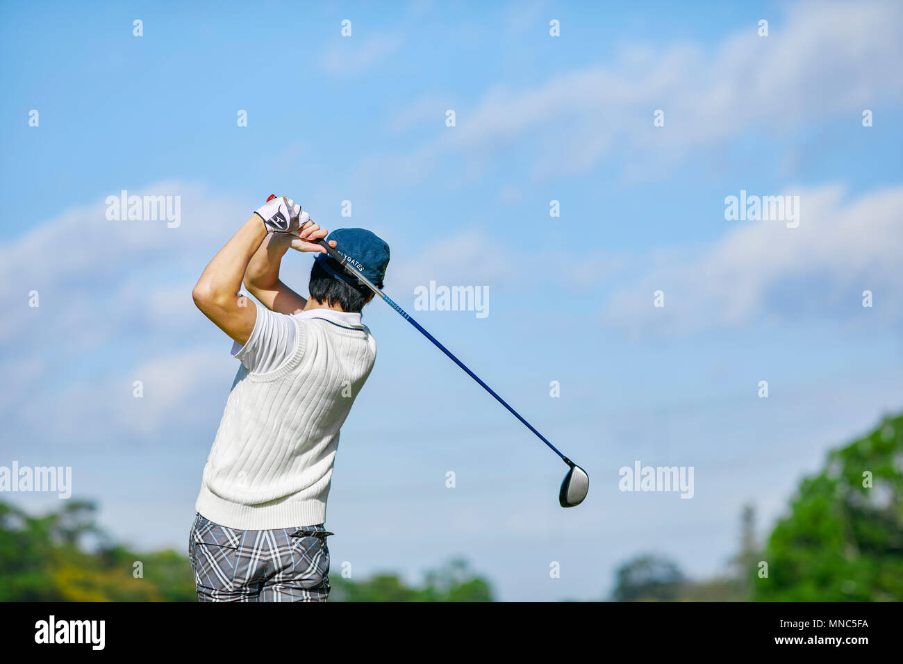 Japanese golf player on course Stock Photo - Alamy