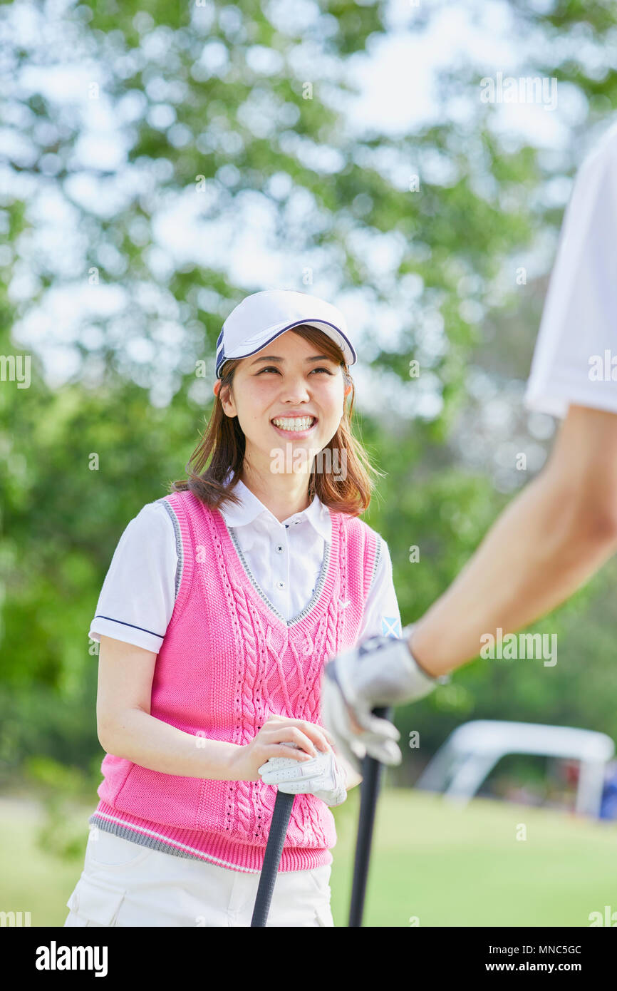 Japanese golf players on course Stock Photo - Alamy