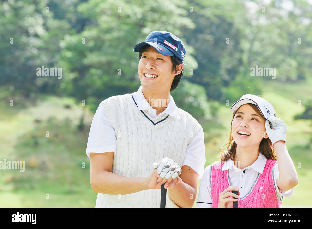 Japanese golf players on course Stock Photo - Alamy