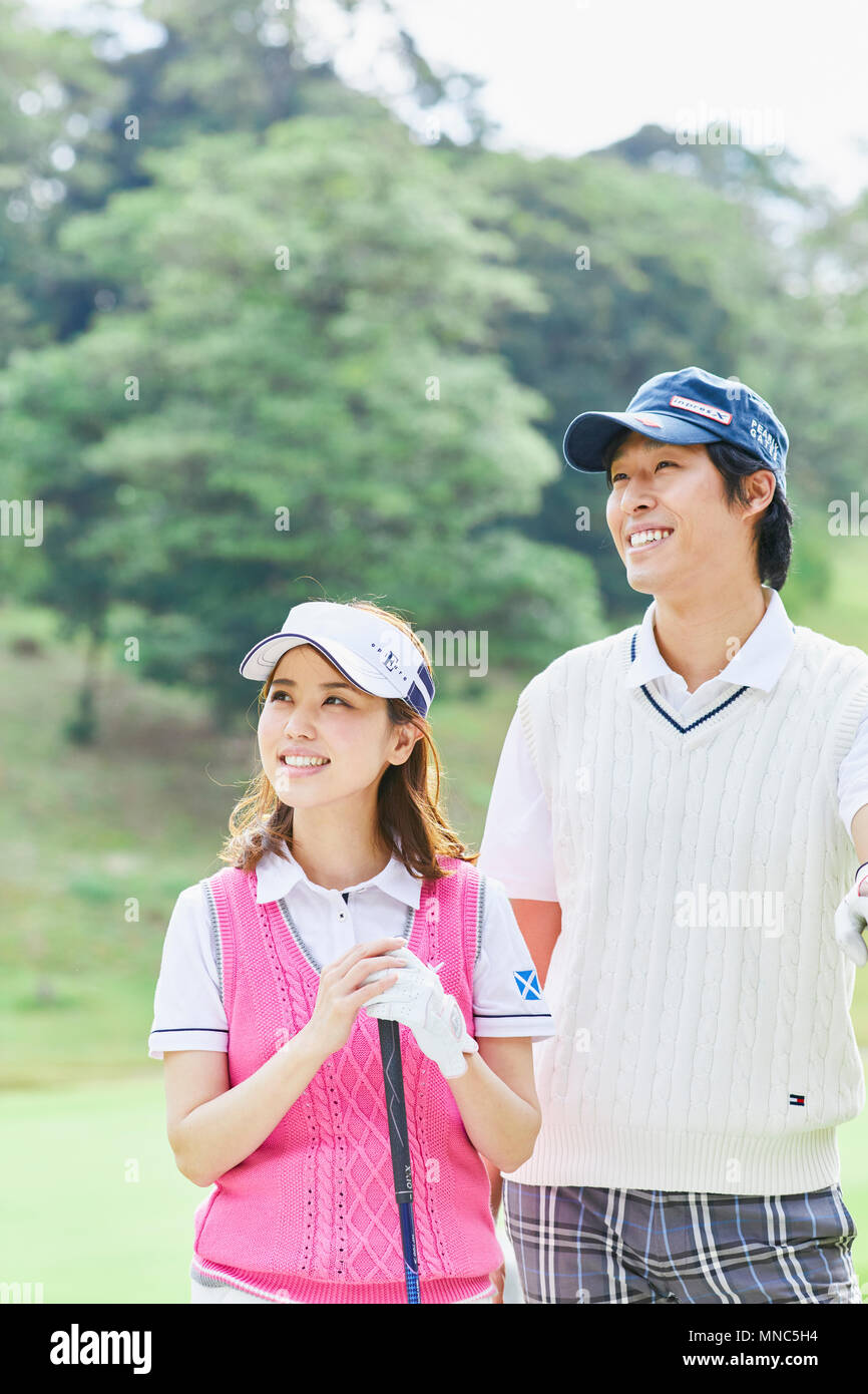 Japanese golf players on course Stock Photo - Alamy