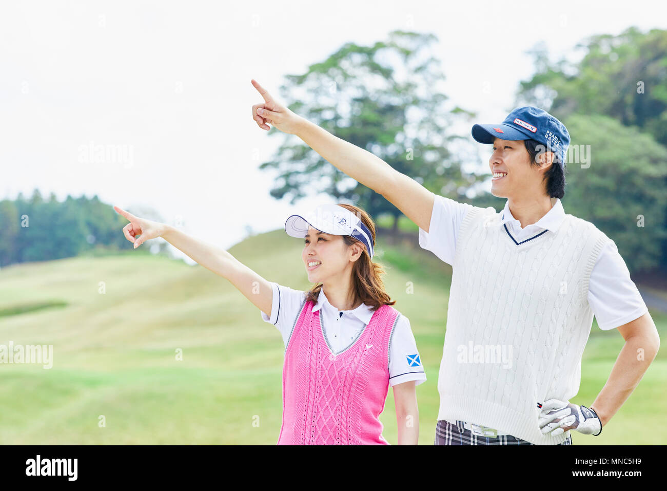 Japanese golf players on course Stock Photo - Alamy