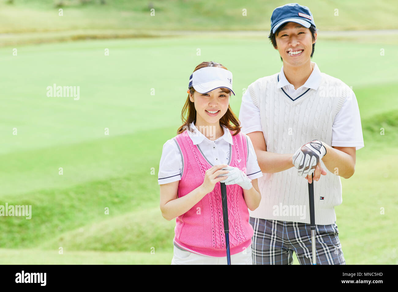Japanese golf players on course Stock Photo - Alamy