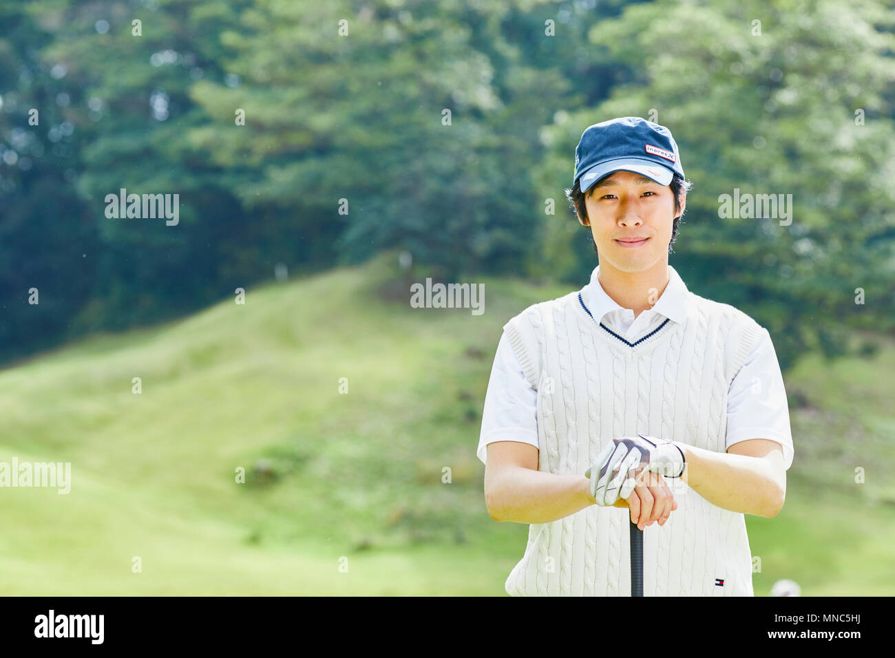 Japanese golf player on course Stock Photo - Alamy