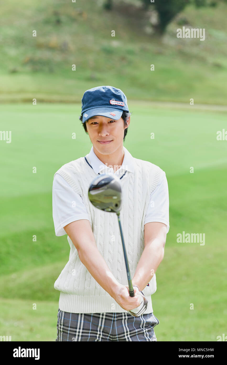 Japanese golf player on course Stock Photo - Alamy