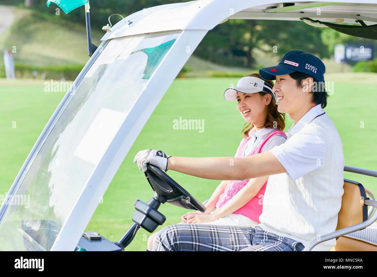 Japanese golf players on course Stock Photo - Alamy