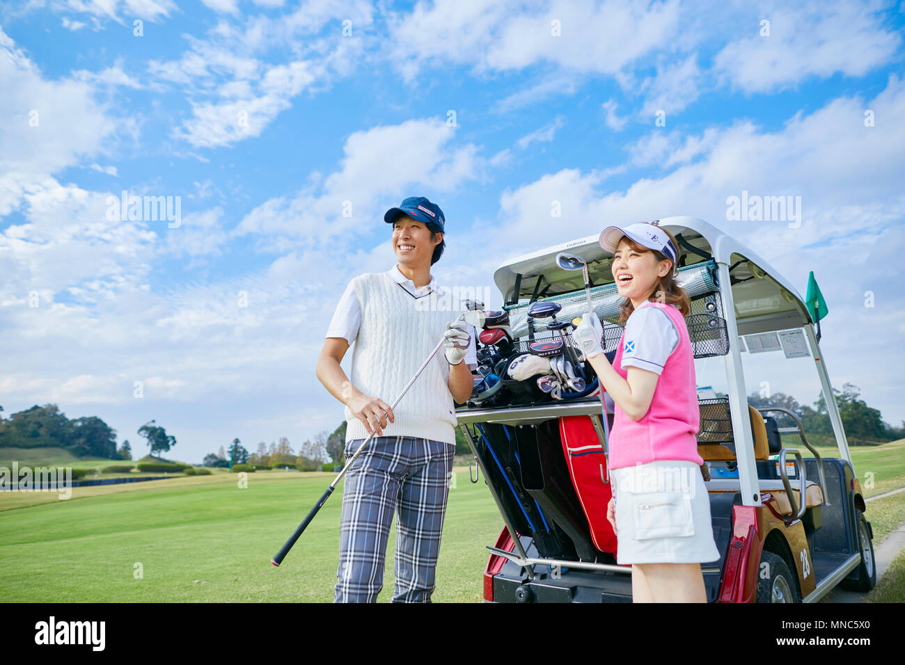 Japanese golf players on course Stock Photo - Alamy