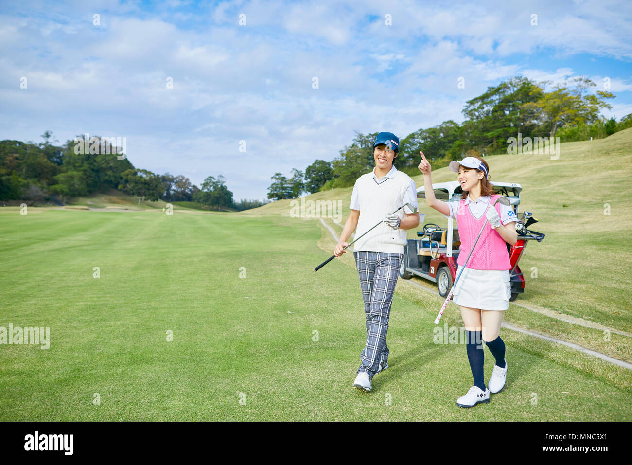 Japanese golf players on course Stock Photo - Alamy