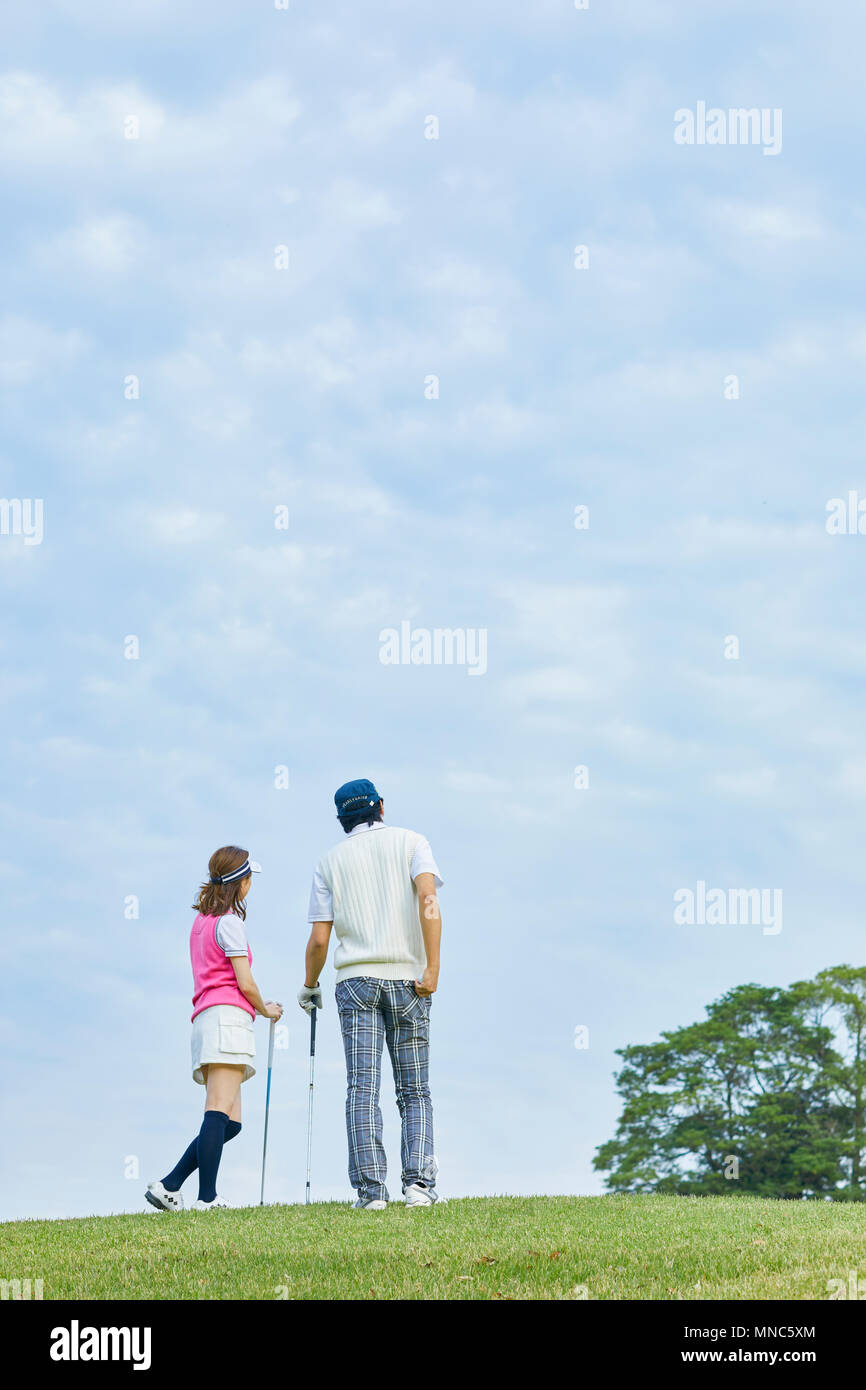 Japanese golf players on course Stock Photo - Alamy