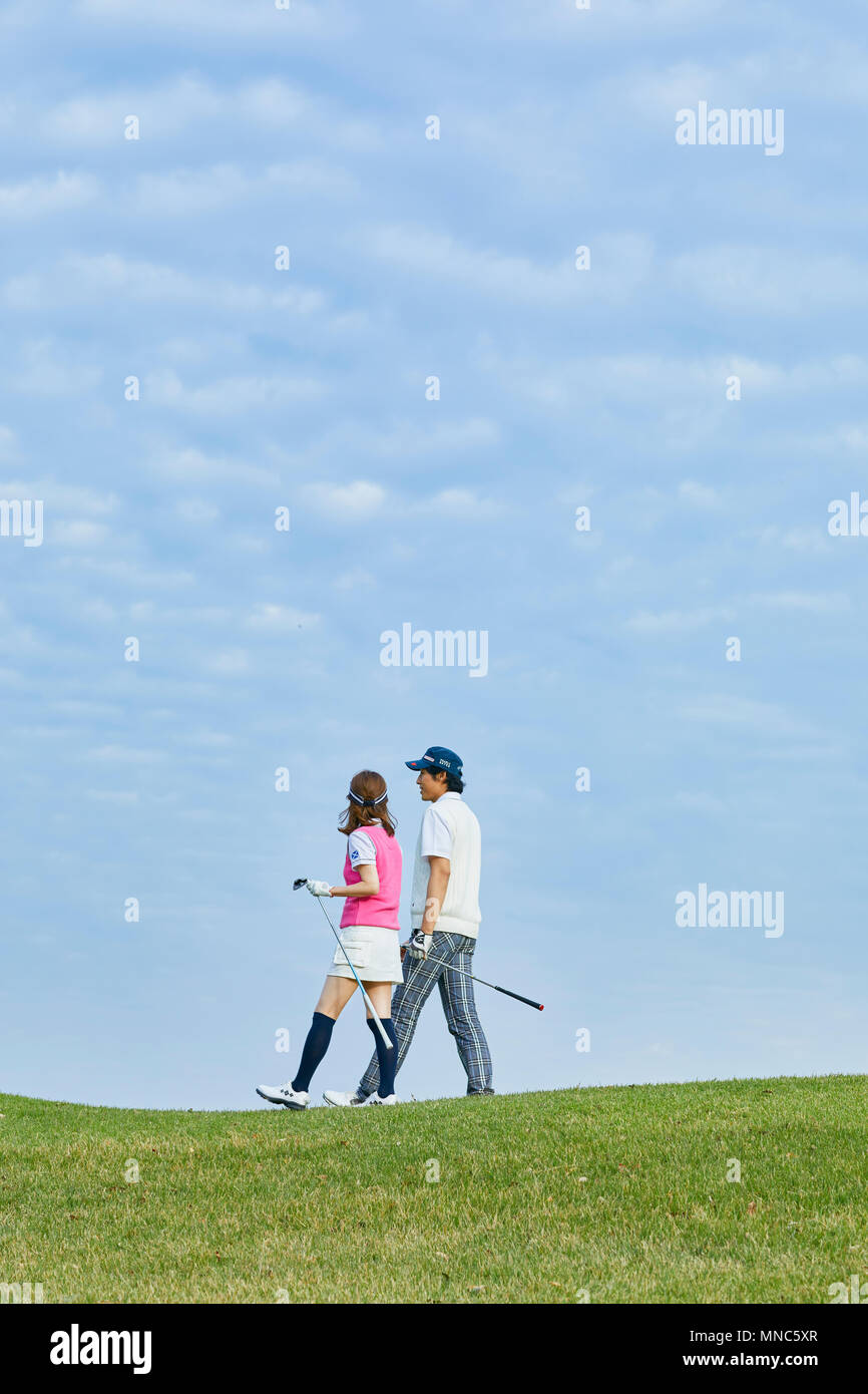 Japanese golf players on course Stock Photo - Alamy
