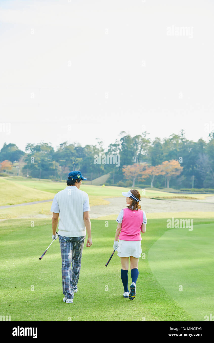 Japanese golf players on course Stock Photo - Alamy