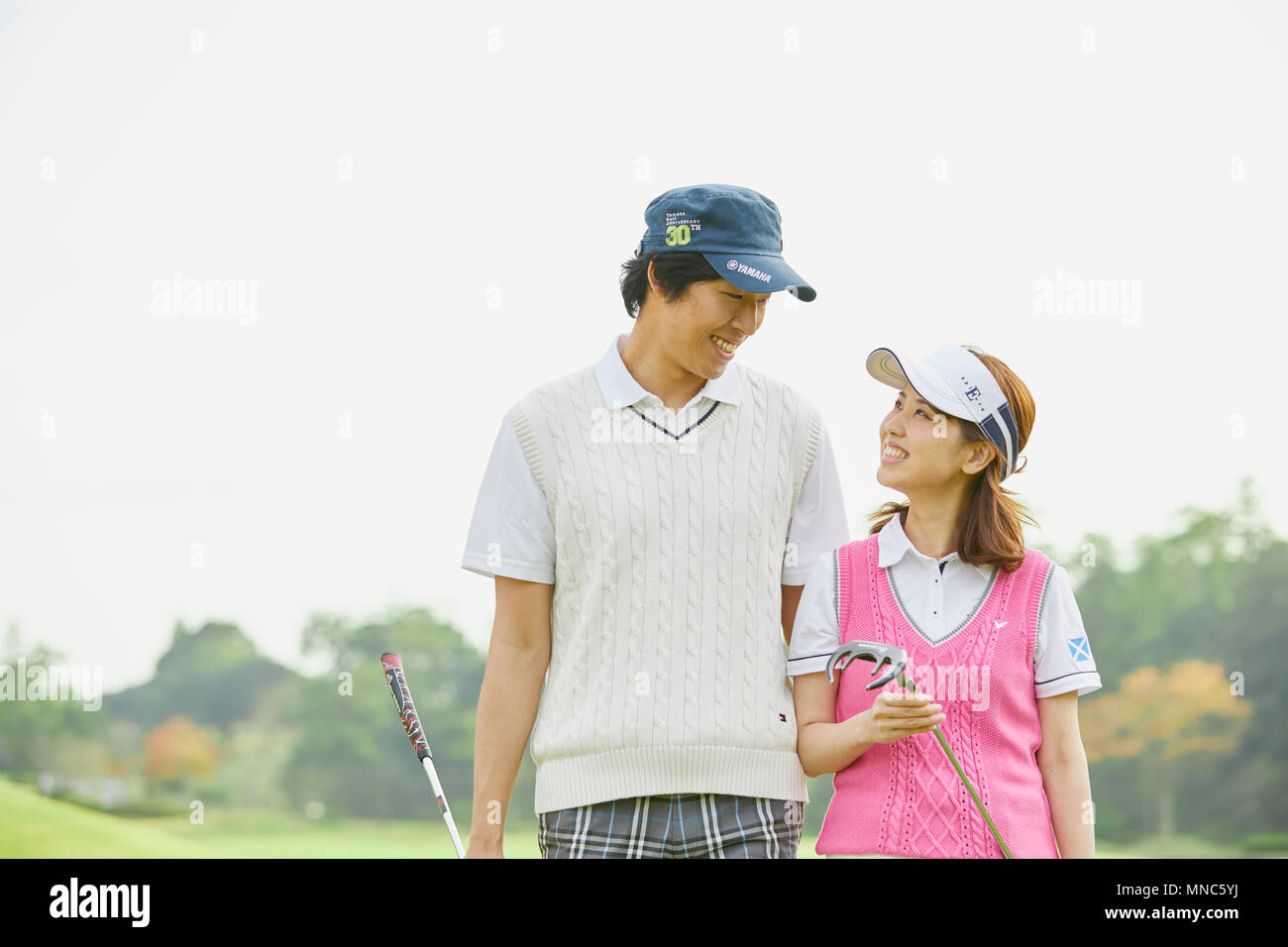 Japanese golf players on course Stock Photo - Alamy