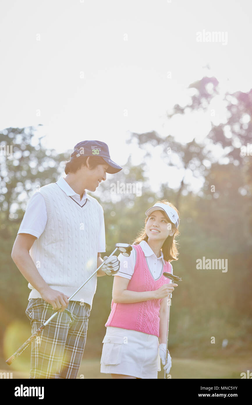 Japanese golf players on course Stock Photo - Alamy