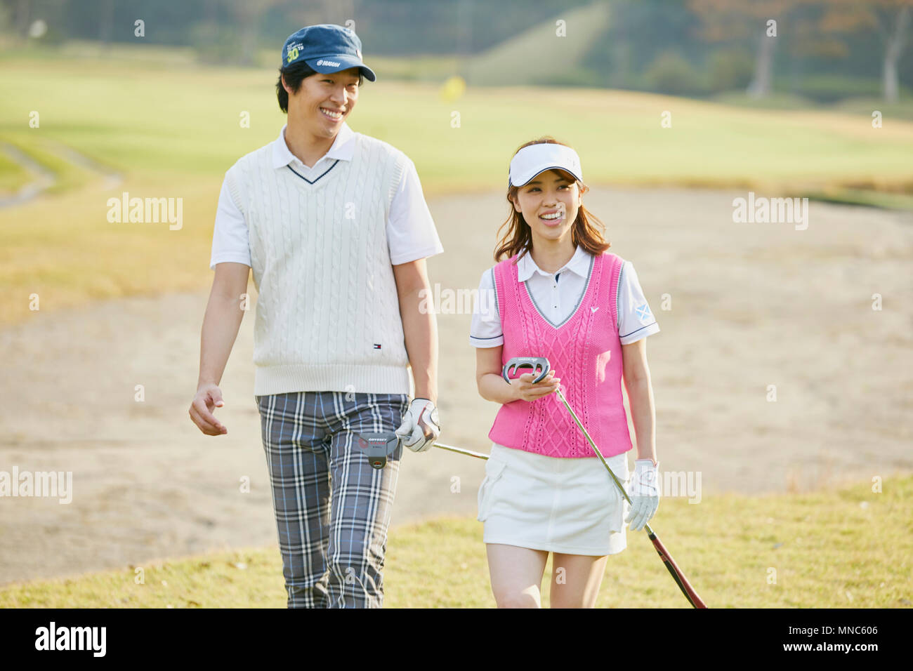 Japanese golf players on course Stock Photo - Alamy