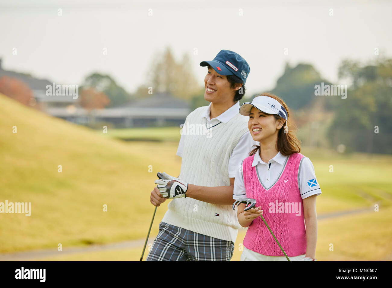 Japanese golf players on course Stock Photo - Alamy