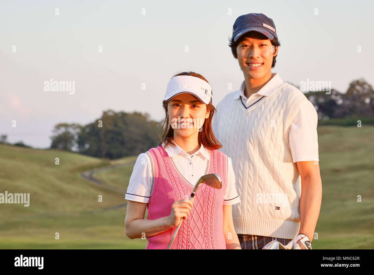 Japanese golf players on course Stock Photo - Alamy