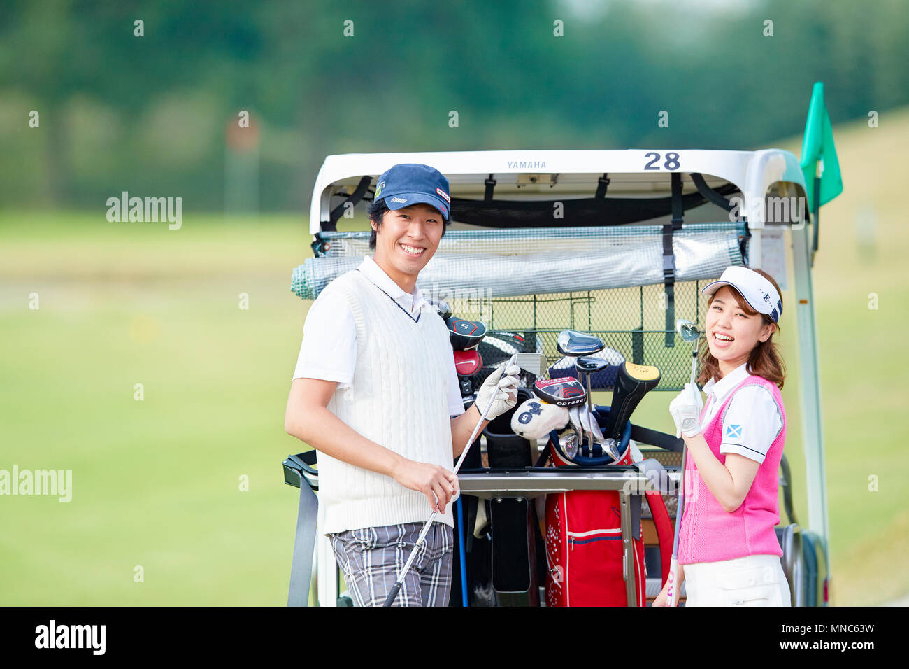 Japanese golf players on course Stock Photo - Alamy