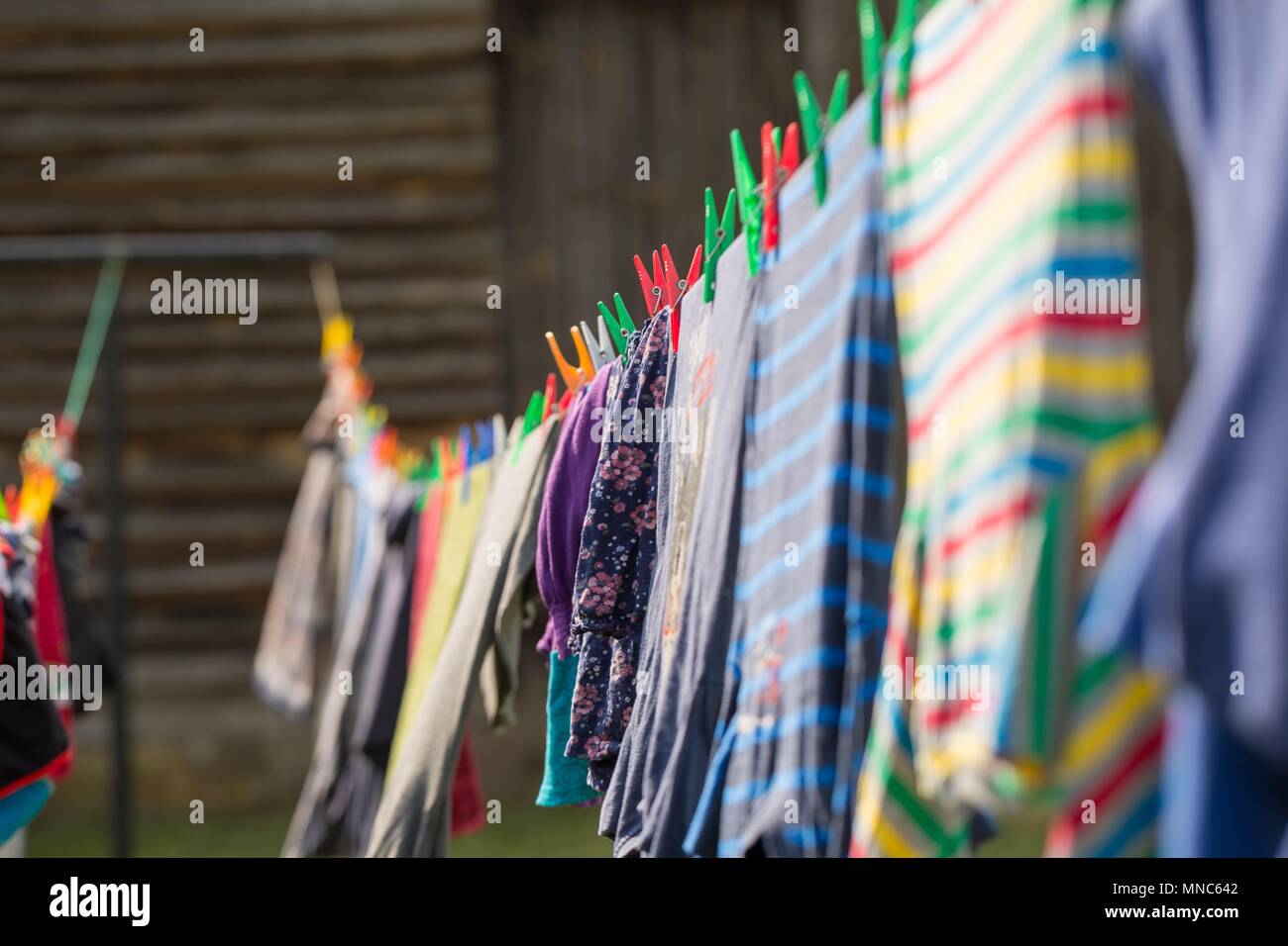 Washing line with drying clothes in outdoor. Clothes hanging on washing ...