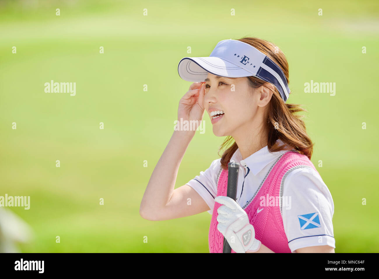 Japanese golf player on course Stock Photo - Alamy