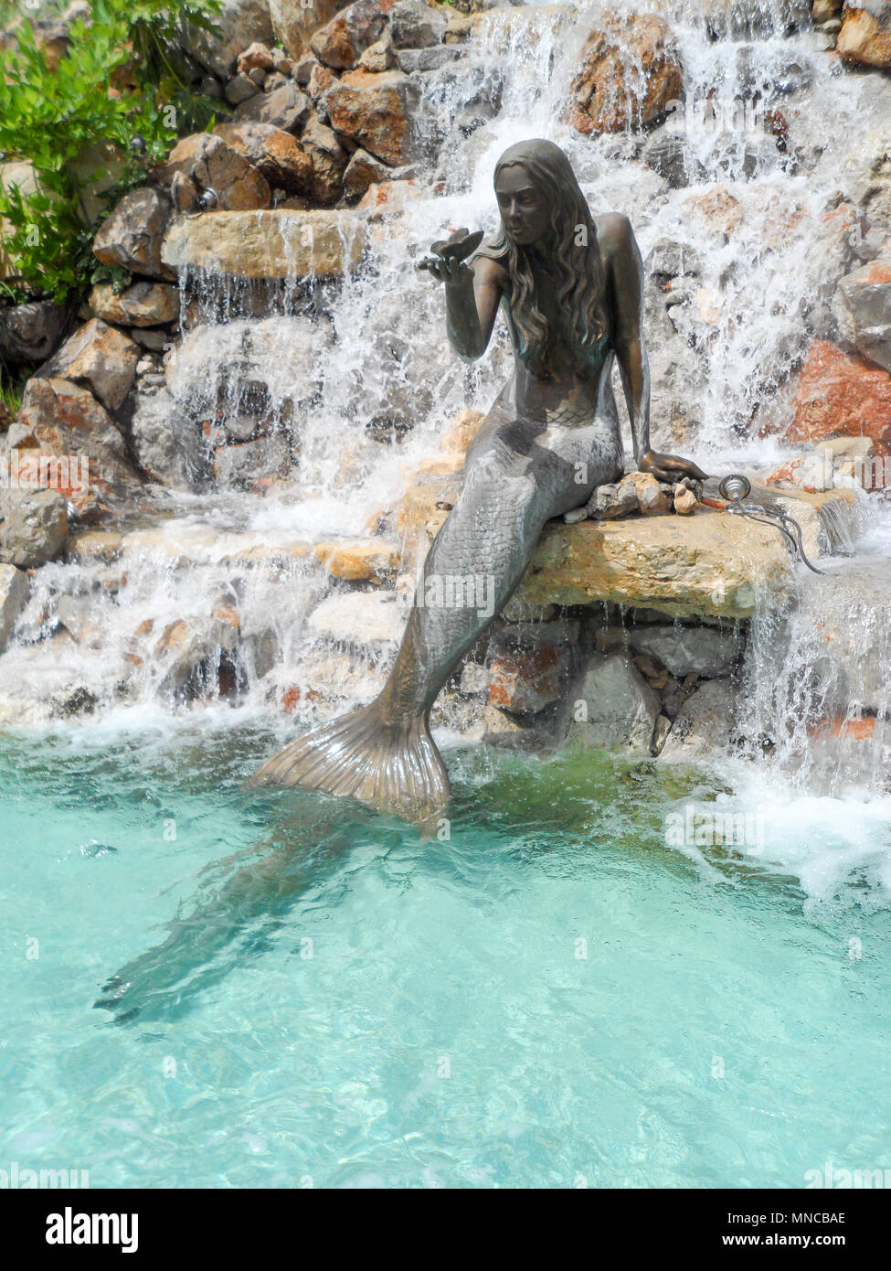 Statue of a mermaid iin a waterfall in Attaturk park, Marmaris, Mugla ...