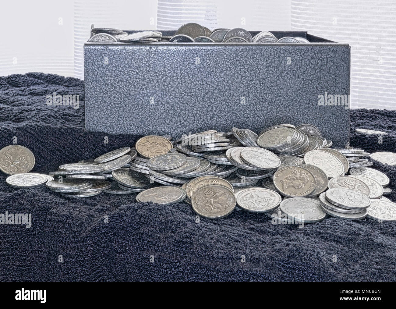 Saving five cent pieces until they overflow from the cash box, then ...