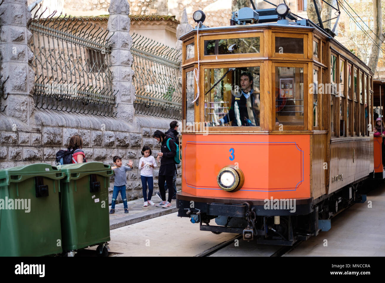 A tram runs through the town of Soller on the Spanish island of ...