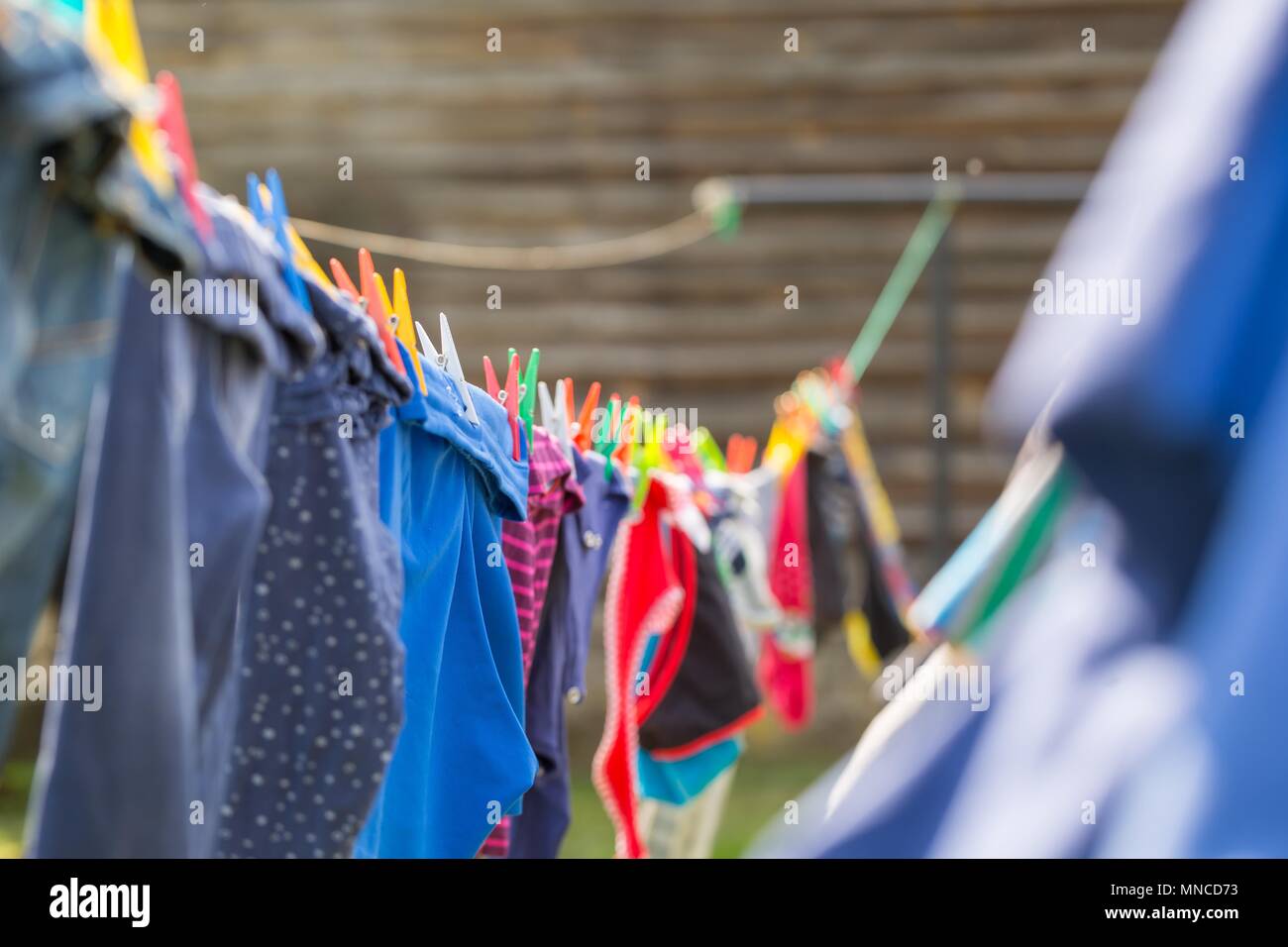 Washing line with drying clothes in outdoor. Clothes hanging on washing ...