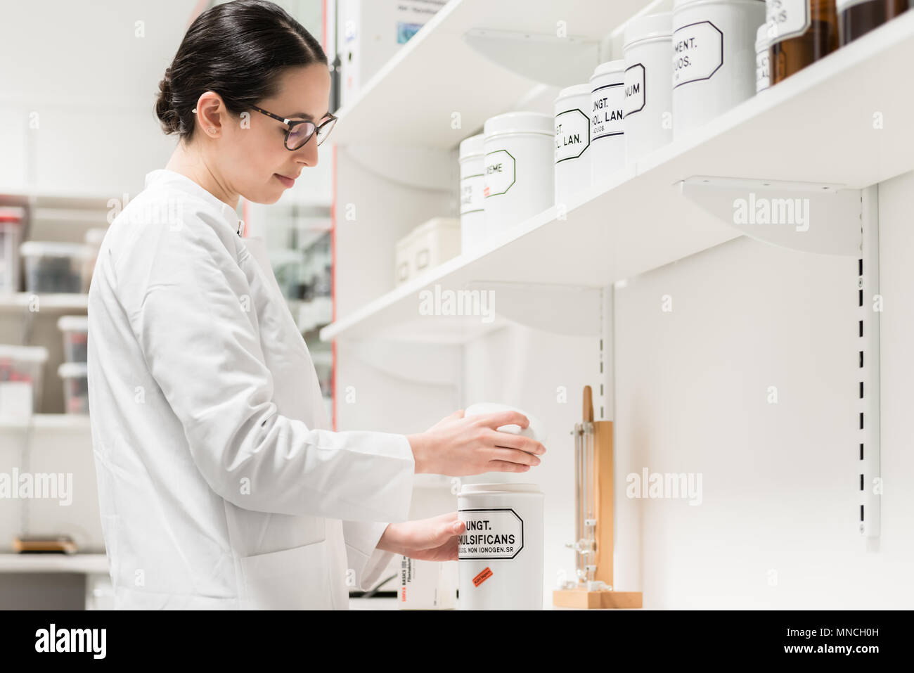 Pharmacist checking a chemical pharmaceutical substance Stock Photo - Alamy