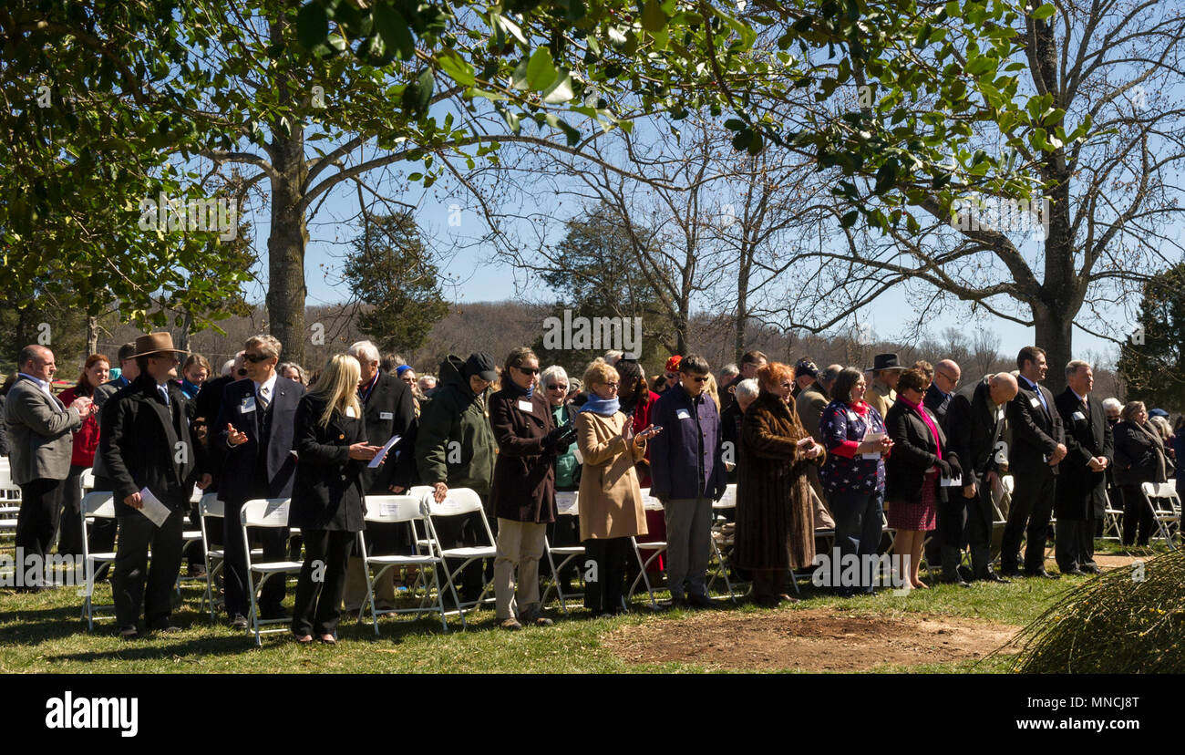 Guests applaud at the end of the Presidential wreath laying ceremony ...