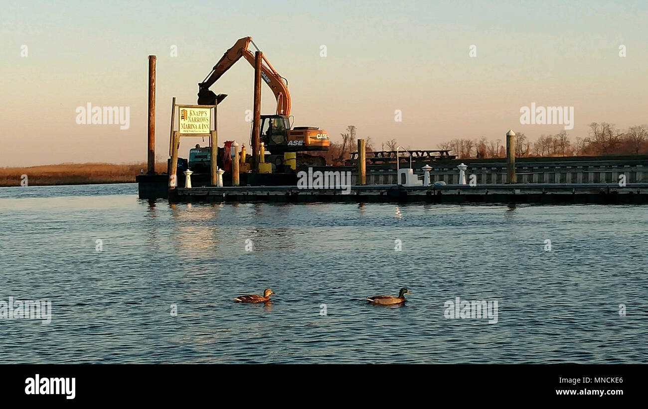 Crews overseen by the U.S. Army Corps of Engineers, Baltimore District ...
