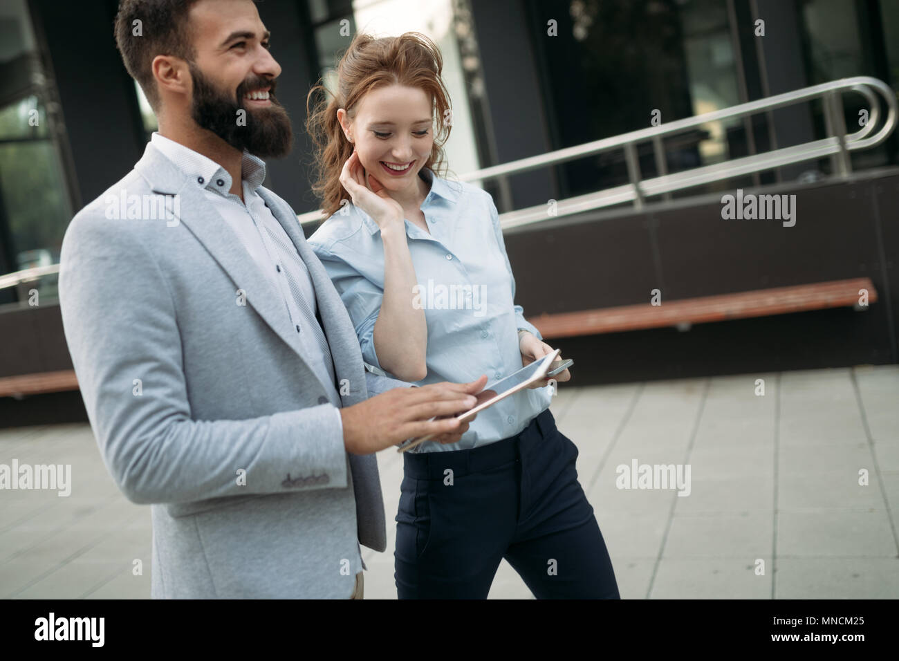 Business people walking and talking outdoor Stock Photo - Alamy