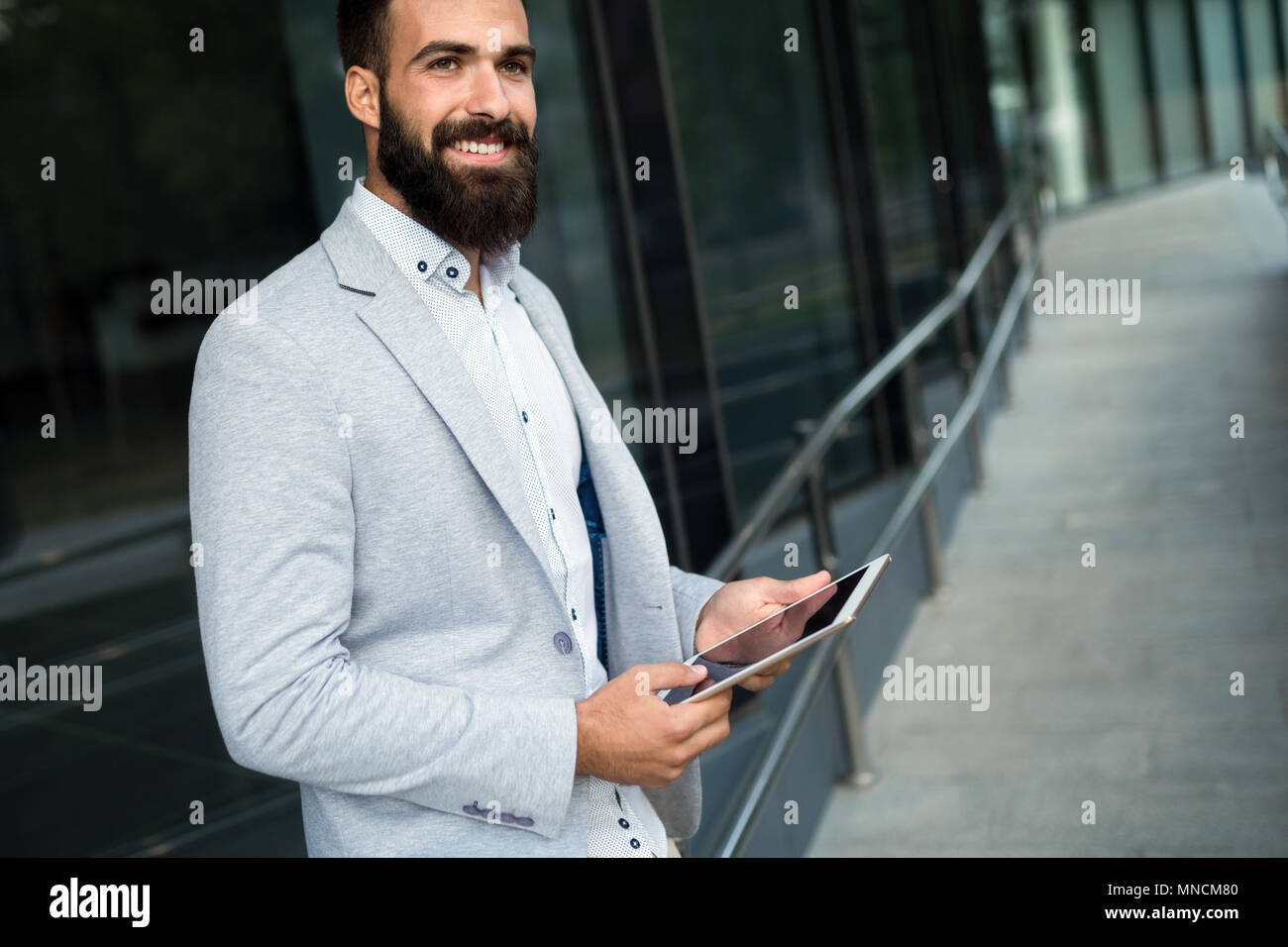 Handsome businessman portrait outdoor Stock Photo - Alamy