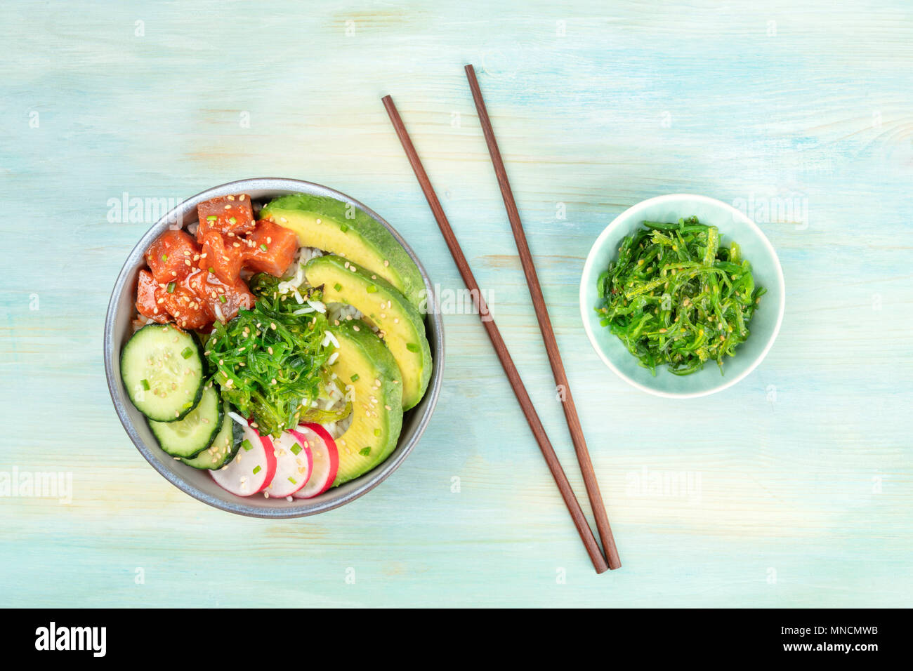 An overhead photo of poke, traditional Hawaiian raw fish salad, with a ...