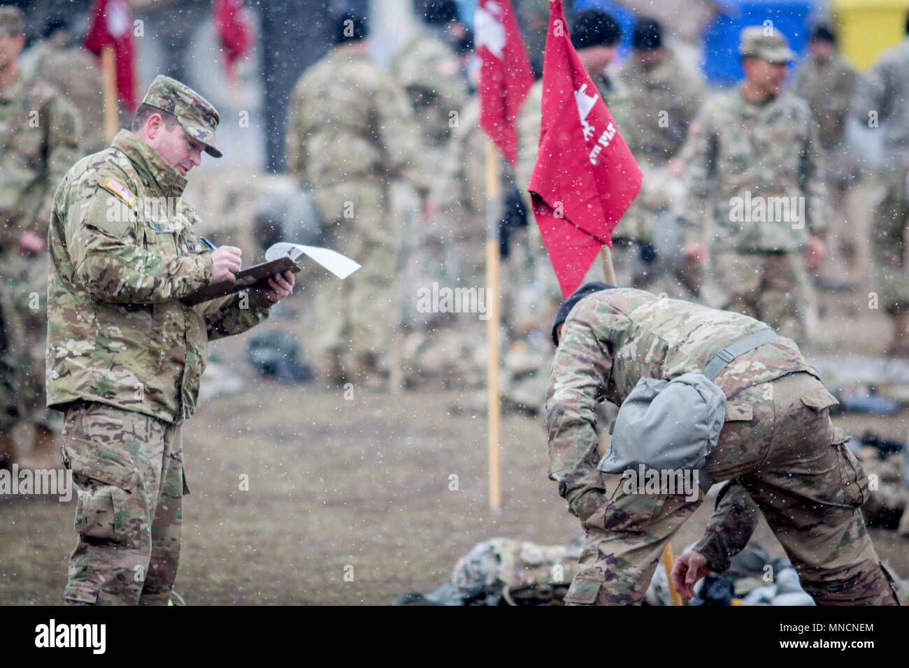 GRAFENWOEHR, Germany –Col. John White inspects a candidates gear during ...