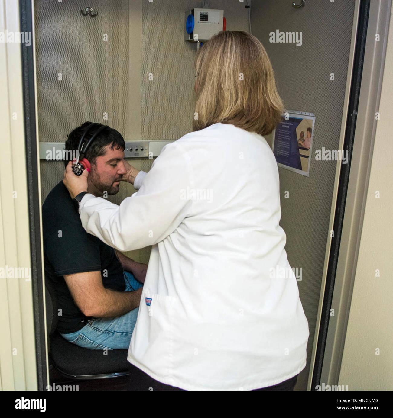Debra Generose, a registered nurse at Tobyhanna Army Depot, adjusts a ...