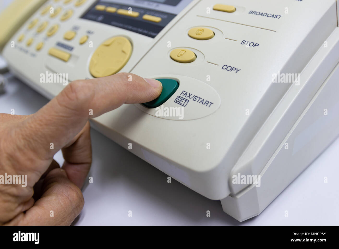 hand man are using a fax machine in the office Business concept Stock ...