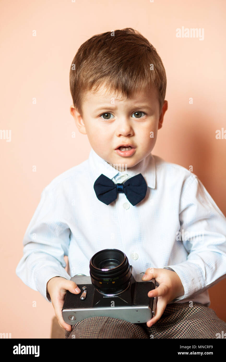 Little boy with aged retro camera. Young photographer. Child with an ...
