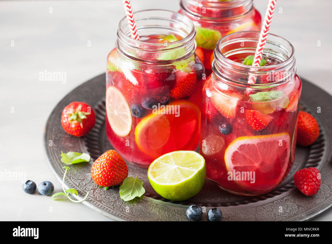 summer berry lemonade with lime and mint in mason jar Stock Photo - Alamy