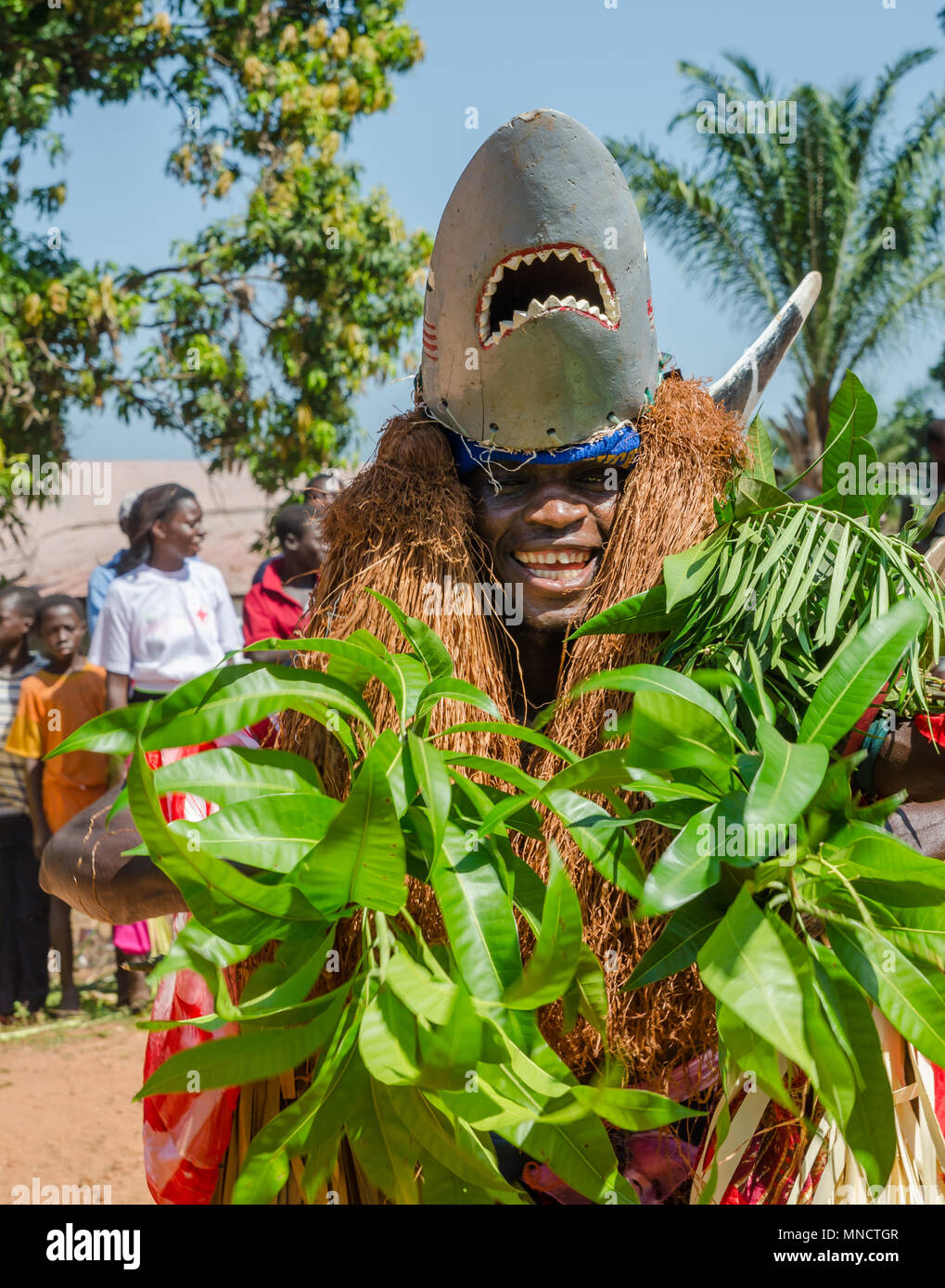Unidentified African man in traditional shark costume doing ritual ...
