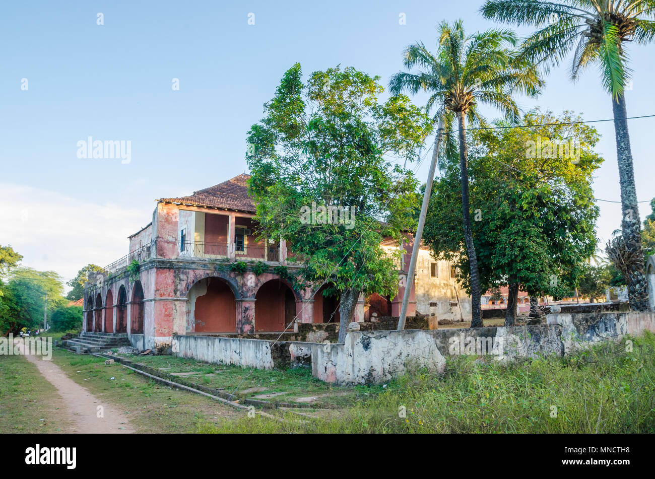 Ruined manson and tropical vegetation next to dirt path Stock Photo - Alamy