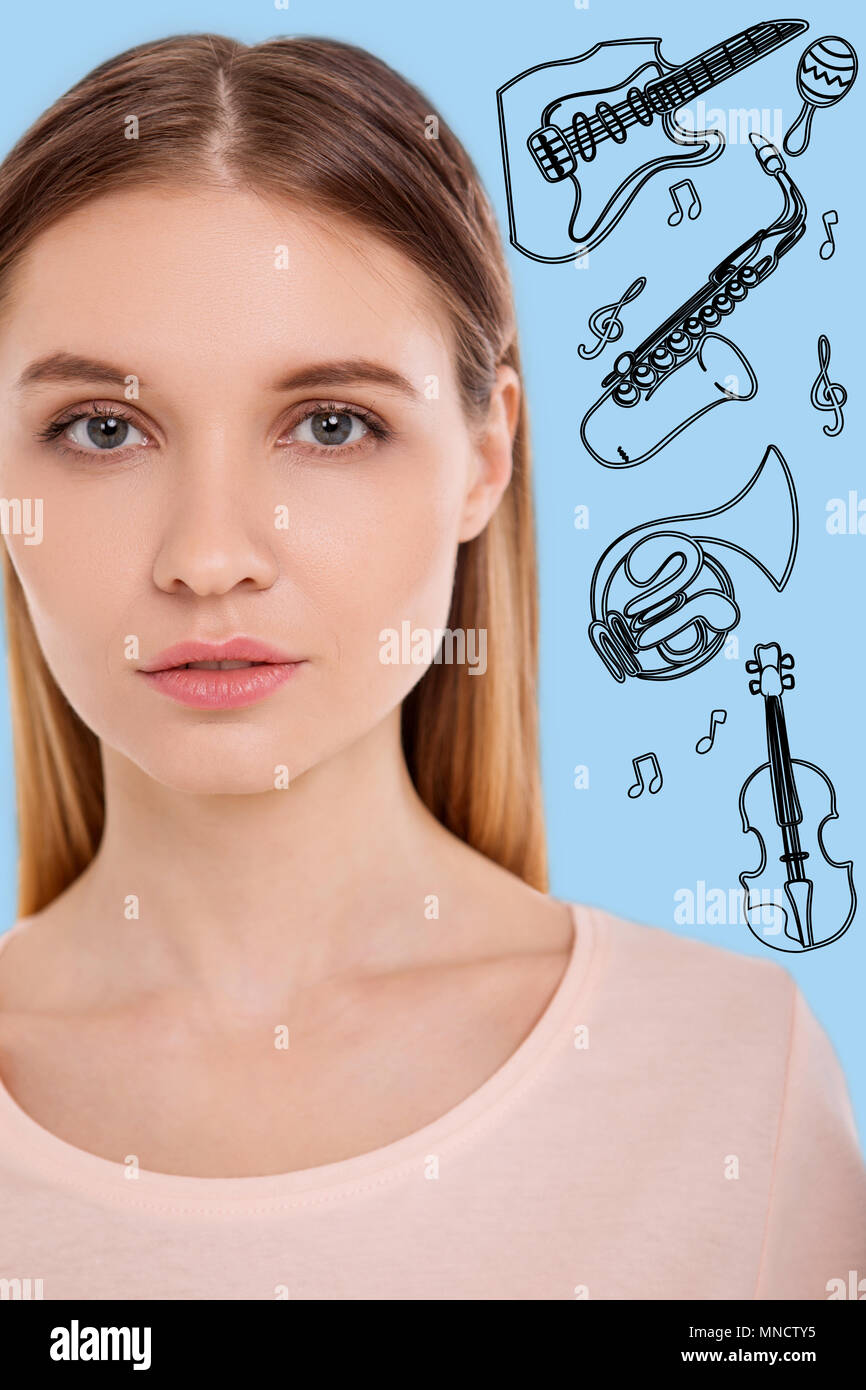 Beautiful musician thinking about her concert and looking calm Stock ...