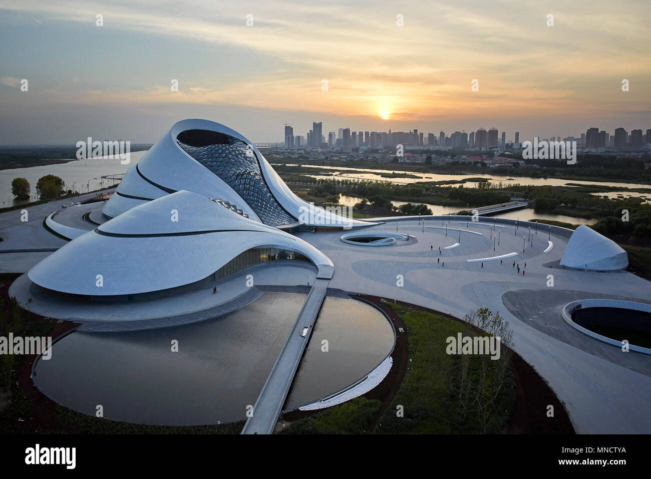 Aerial view of opera house embedded in Harbin's wetland with Songhua ...