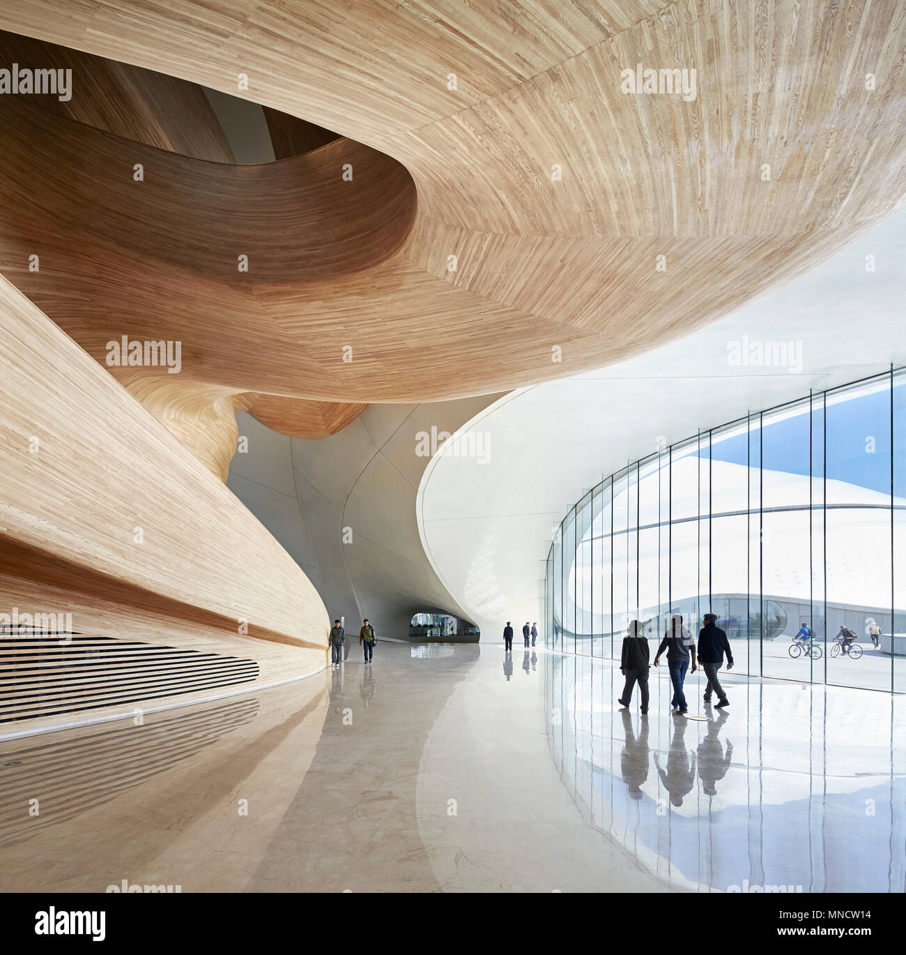 Foyer with window wall and feature staircase. Harbin Opera House ...