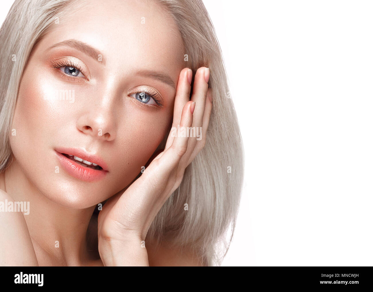 Beautiful young girl with a light natural make-up and perfect skin ...